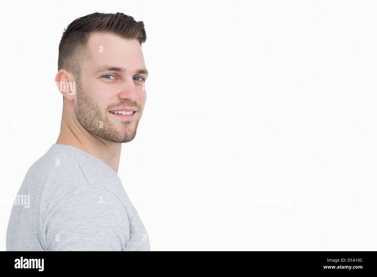 Side view of smiling young man Stock Photo - Alamy