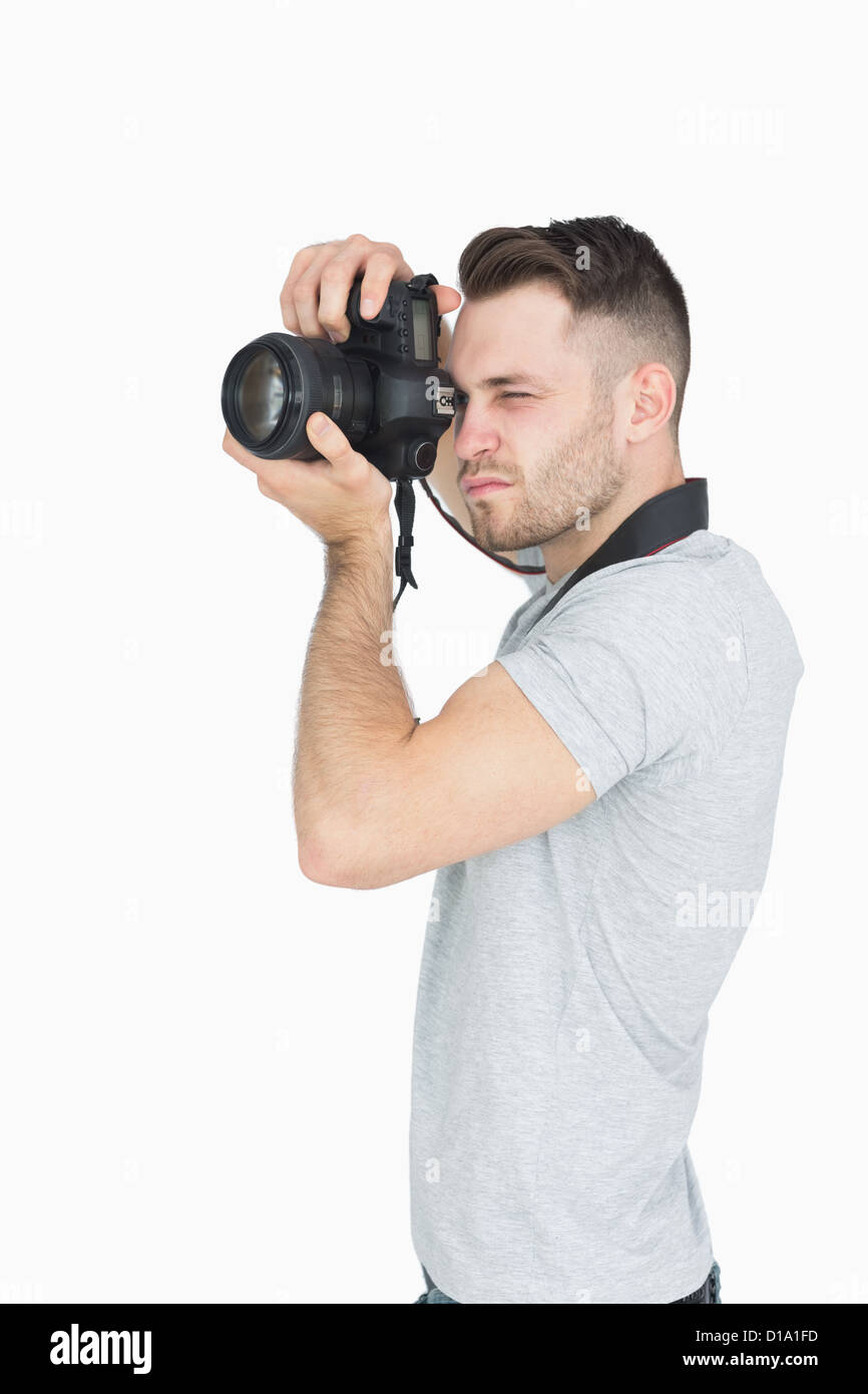 Side view of photographer with photographic camera Stock Photo - Alamy