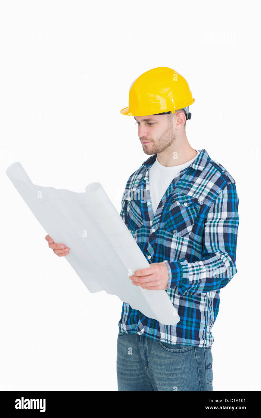 Young male architect with blueprint Stock Photo - Alamy