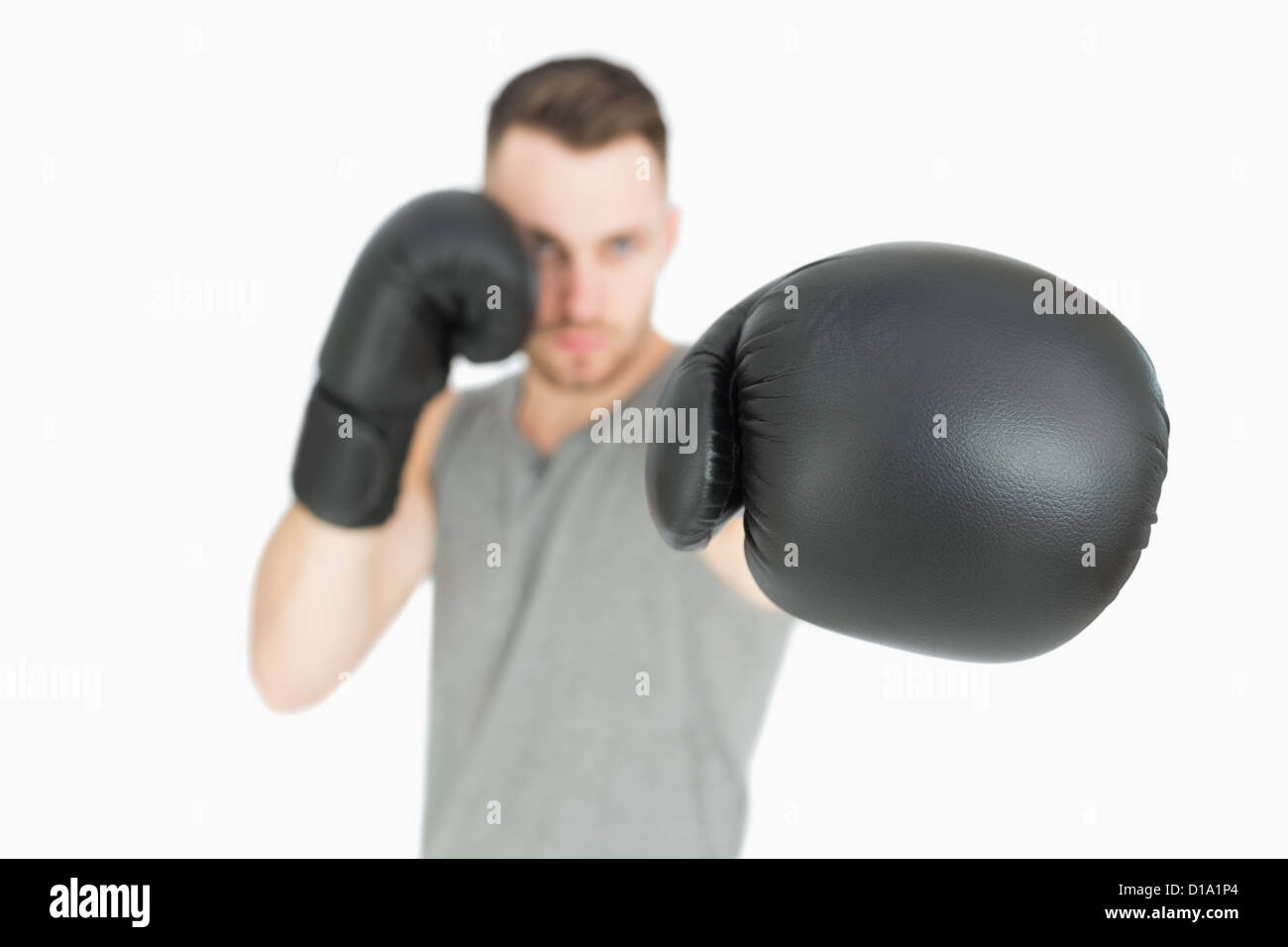 Portrait of young male boxer punching Stock Photo - Alamy