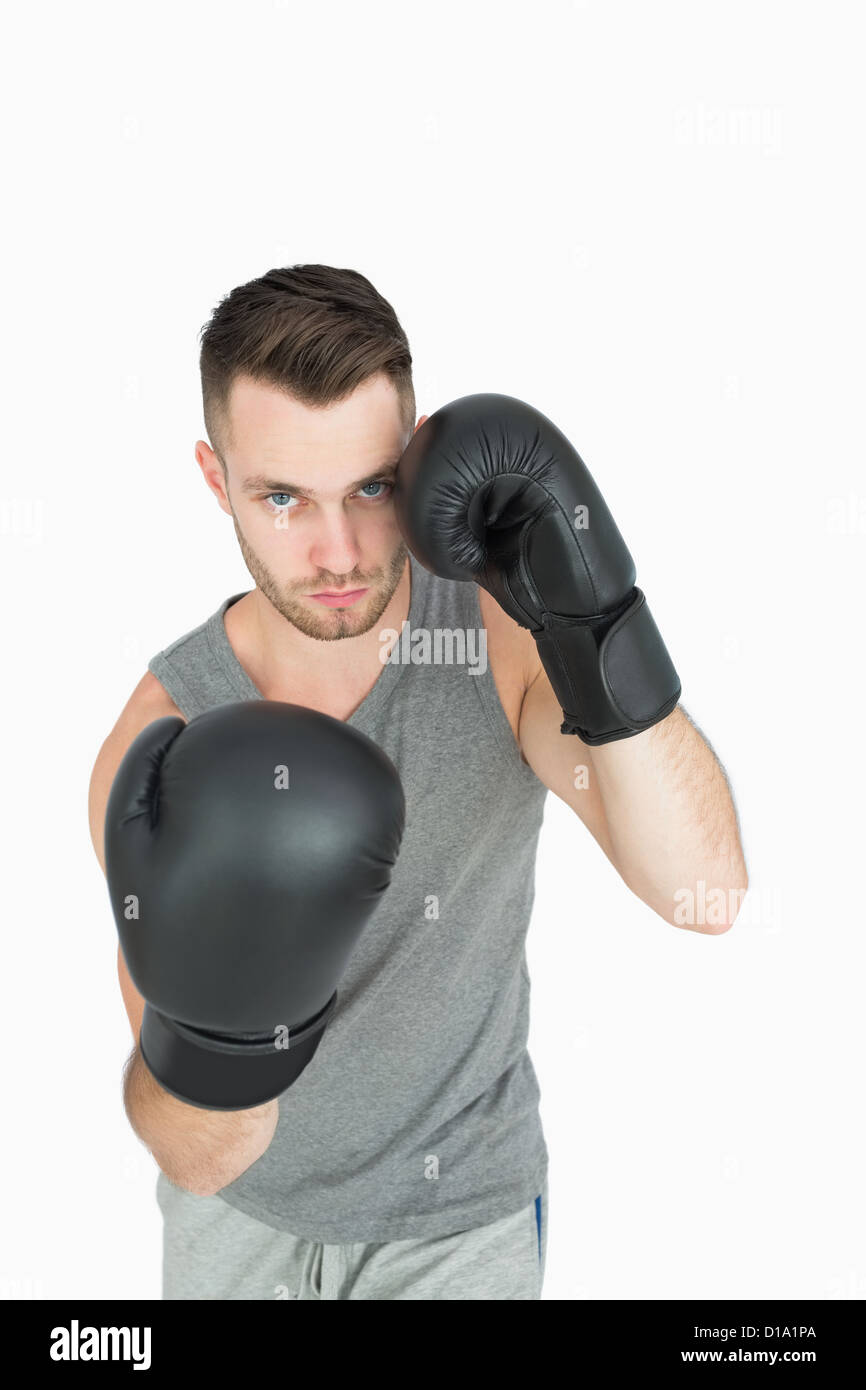 Portrait of young man in boxing stance Stock Photo - Alamy