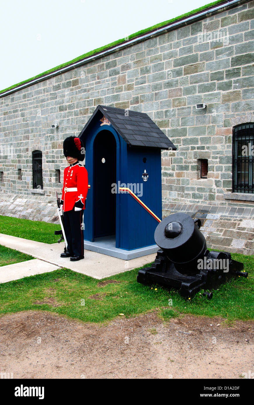 Military guard in full dress stands at attention by guard post at ...