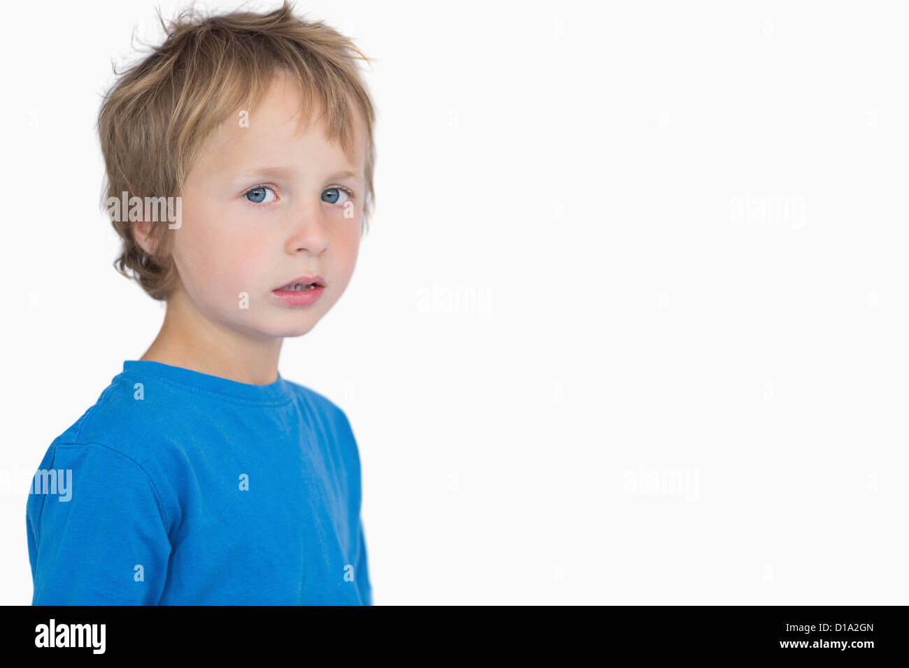 Portrait of cute young boy standing Stock Photo - Alamy