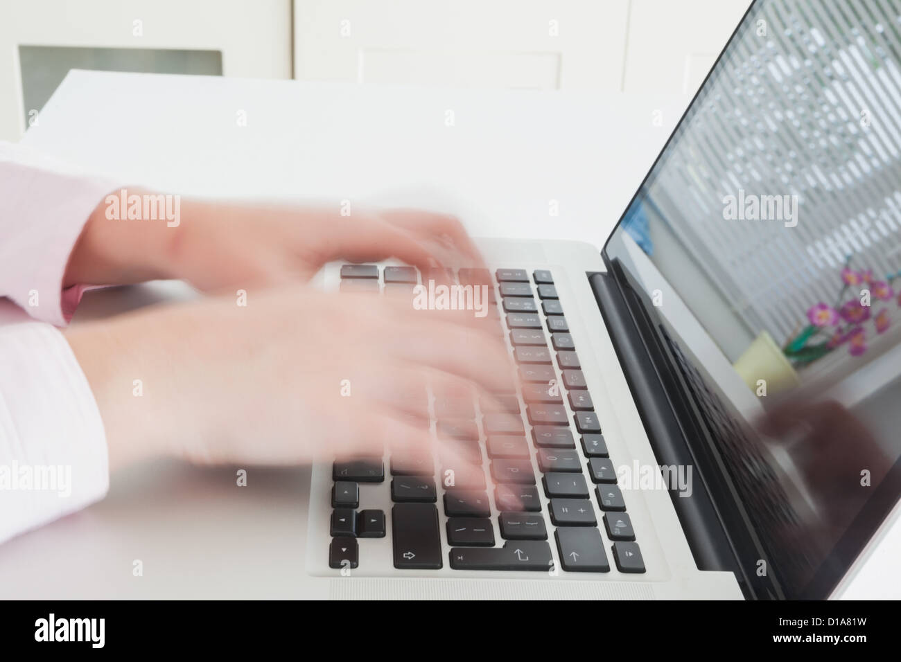 Hands using laptop Stock Photo - Alamy