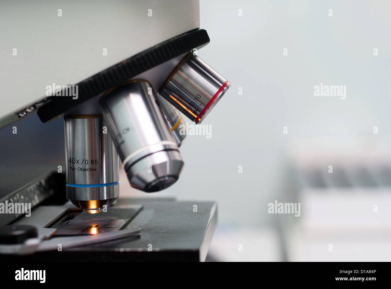 Microscope in lab on gray Stock Photo - Alamy