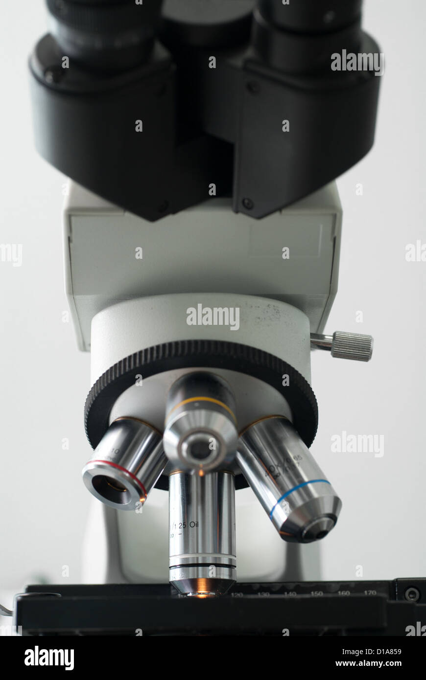 Microscope in lab on gray backgroud Stock Photo - Alamy