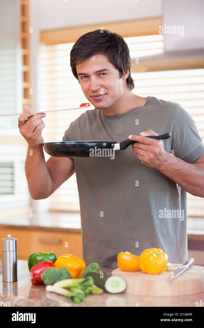 Man cooking food in the kitchen Stock Photo - Alamy