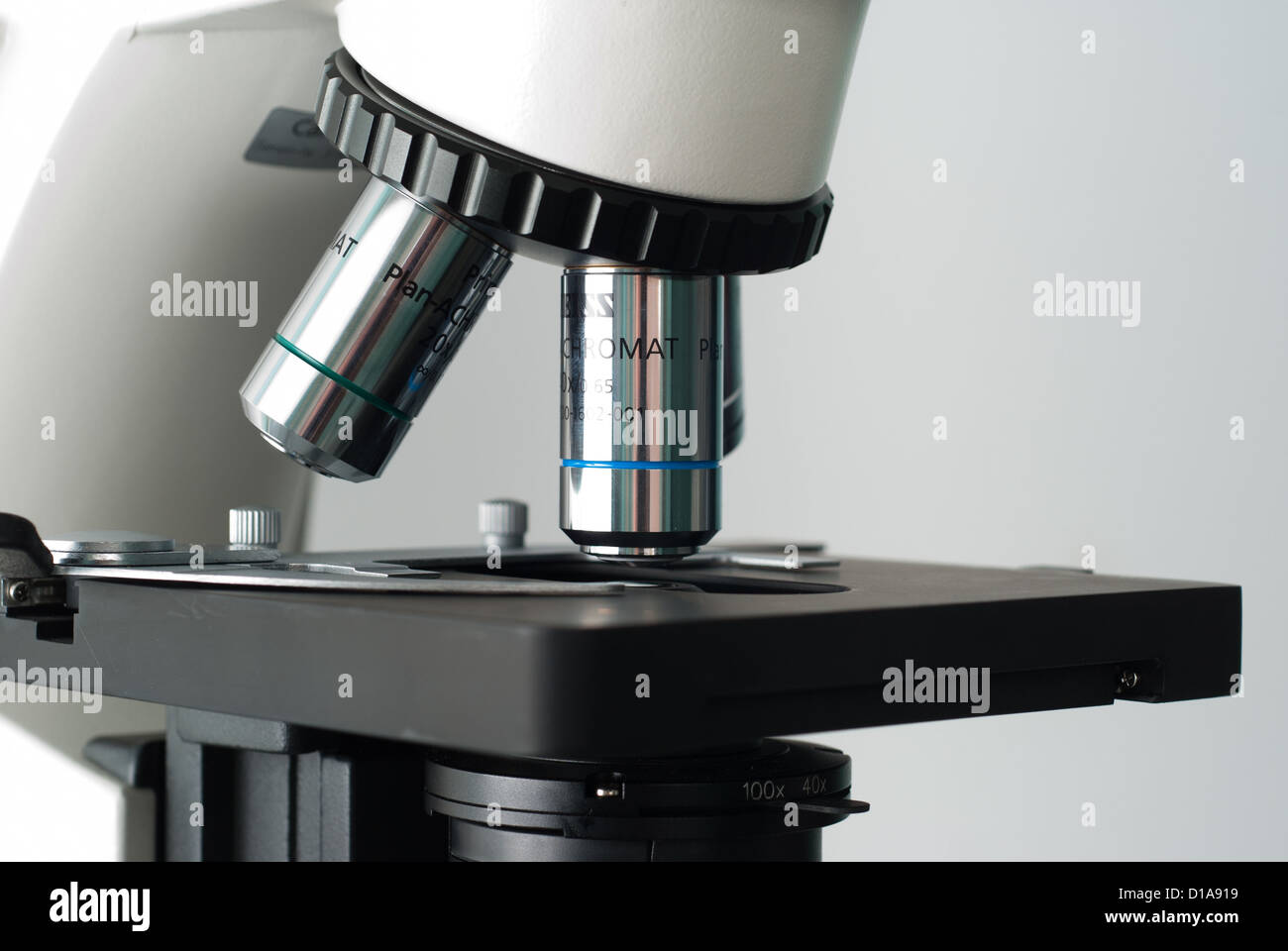 Microscope in lab on gray backgroud Stock Photo - Alamy