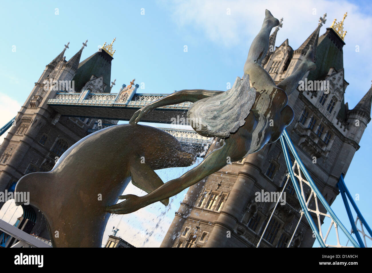 A water sculpture in a fountain with part of Tower Bridge in the ...