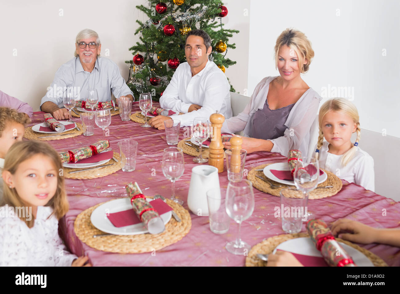 Smiling family at the dinner table Stock Photo - Alamy