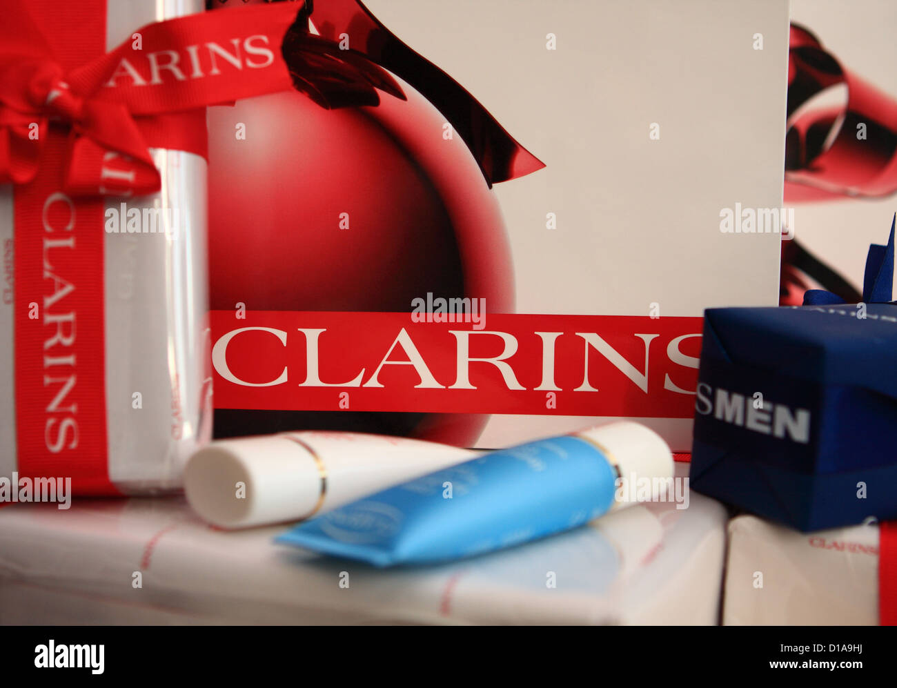 Parts of twoClarins shopping bags, wrapped Clarins gifts and loose ...