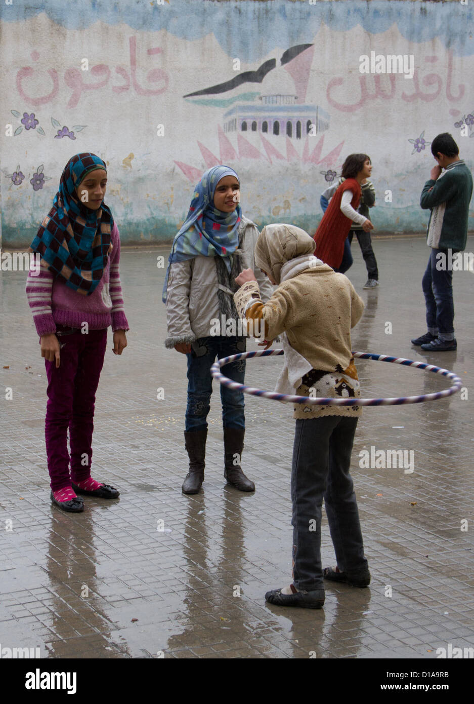 Aleppo, Syria: Children play after school on a play ground. This school ...