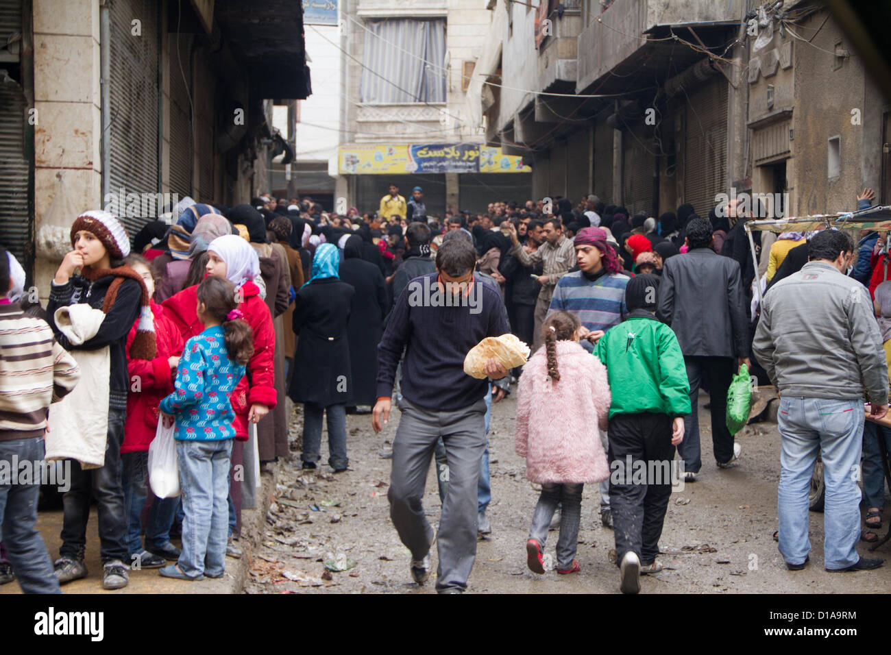 December 4, 2012 - Aleppo, Syria: People wait in line for bread at a ...