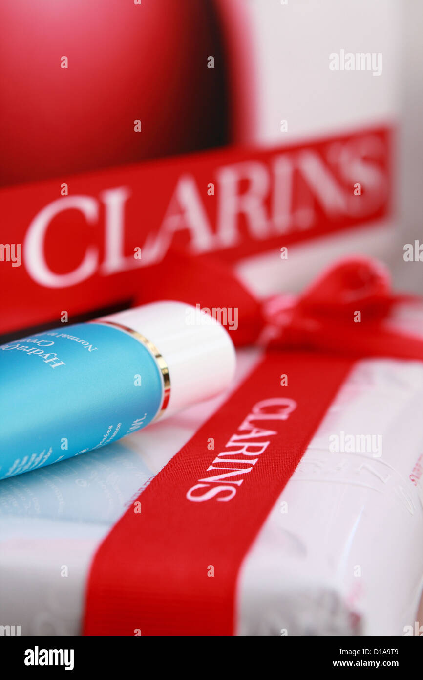 A Clarins shopping bag, wrapped Clarins gifts and loose products in ...