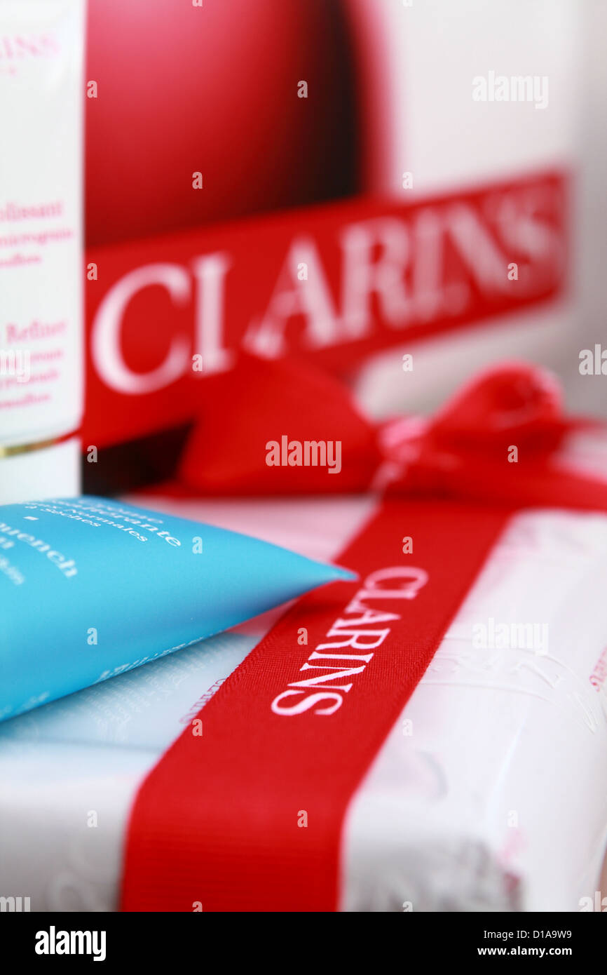 A Clarins shopping bag, wrapped Clarins gifts and loose products in ...