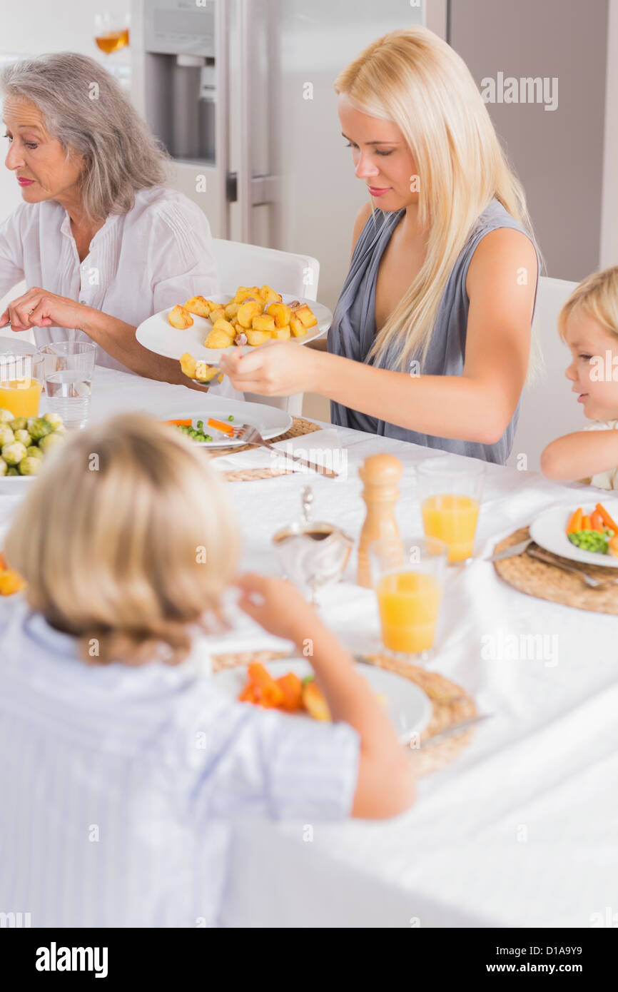 Woman serving herself at dinner table hi-res stock photography and ...