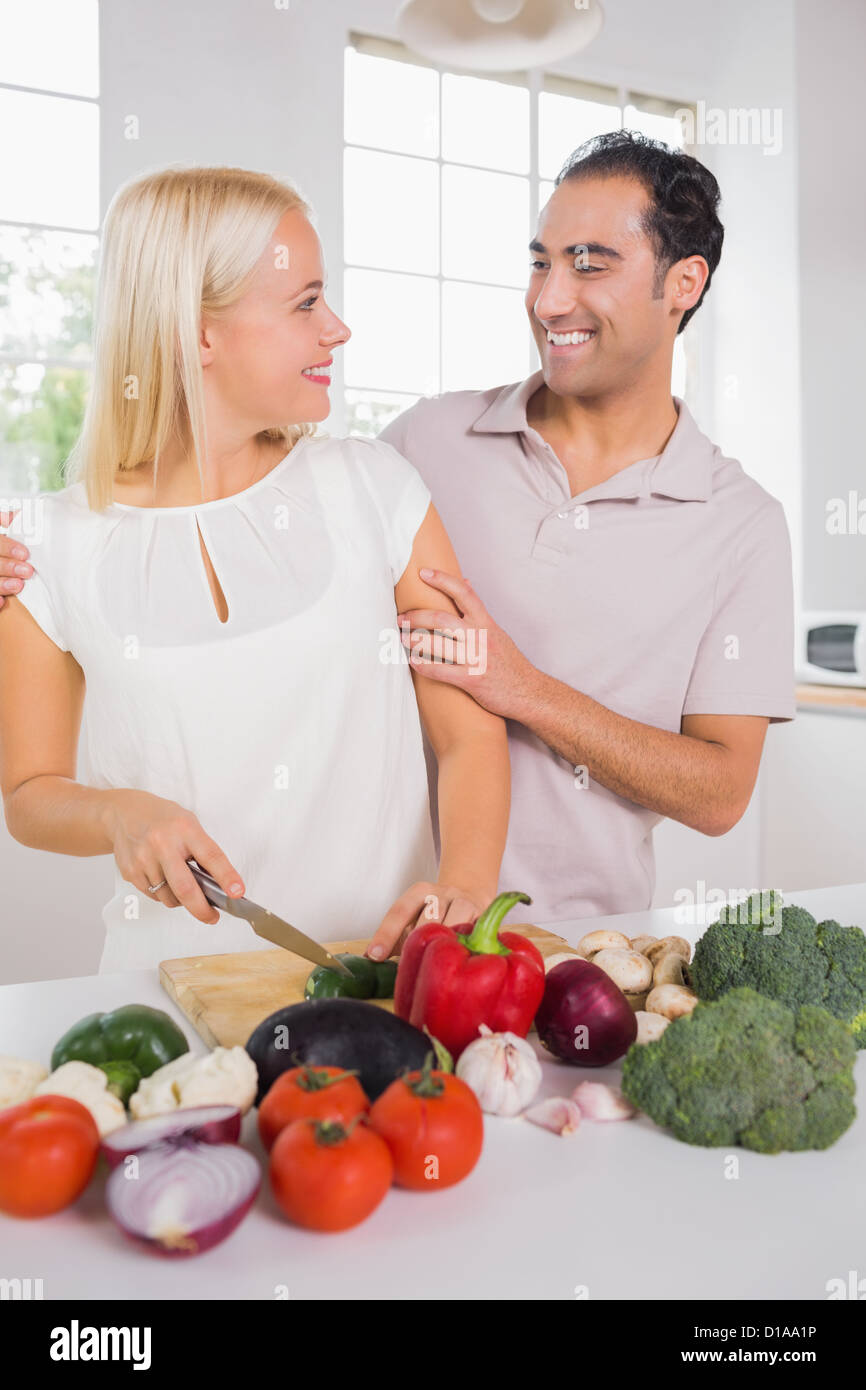 Lovely couple preparing the dinner Stock Photo - Alamy