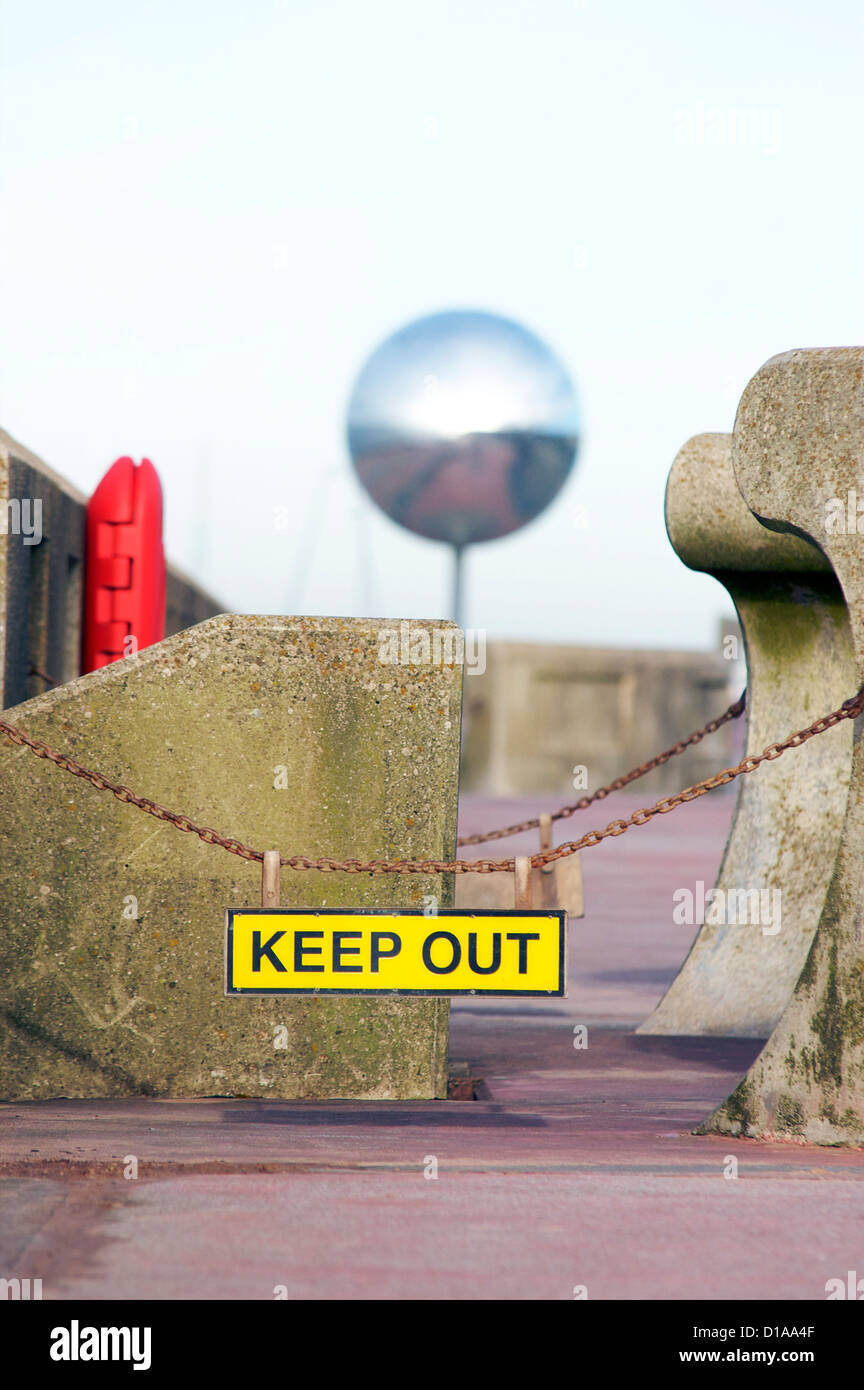 Chained off area on concrete seawall Stock Photo - Alamy