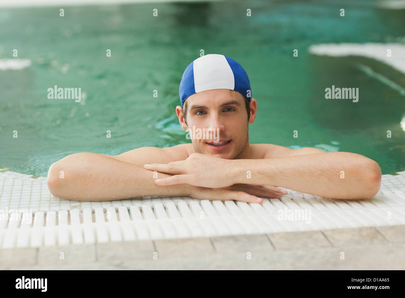 Smiling man in the pool Stock Photo - Alamy