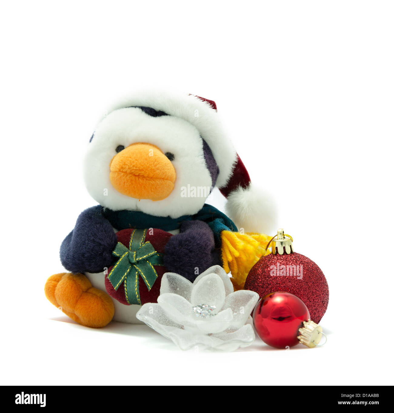 Santa Penguin with present and christmas decorations Stock Photo - Alamy