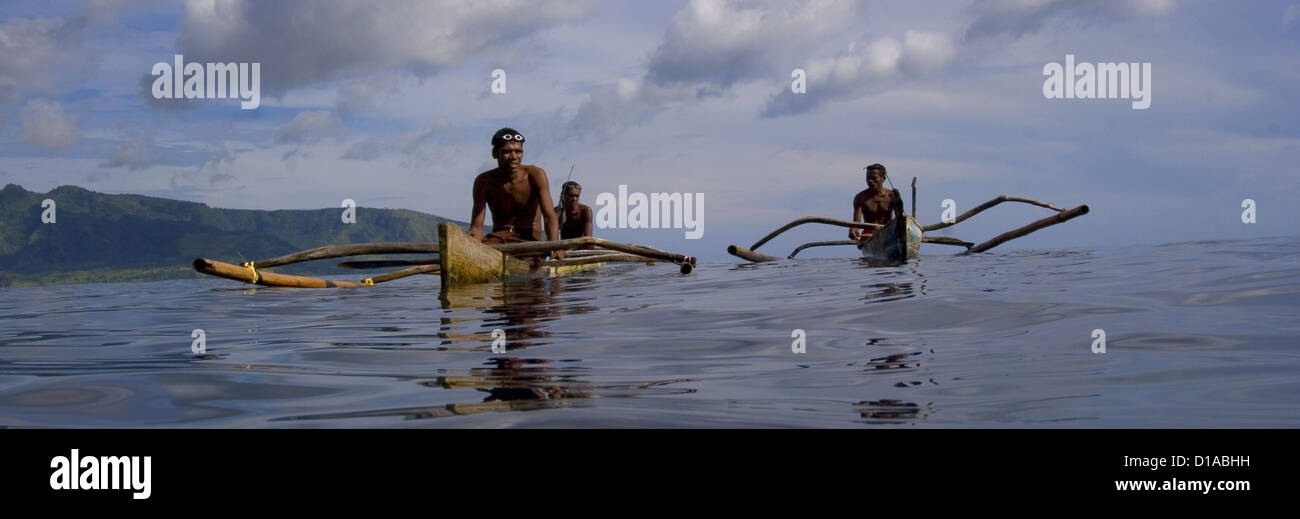 Indonesia, Pura Island, Two Outrigger Canoes Of Native Fisherman Stock ...