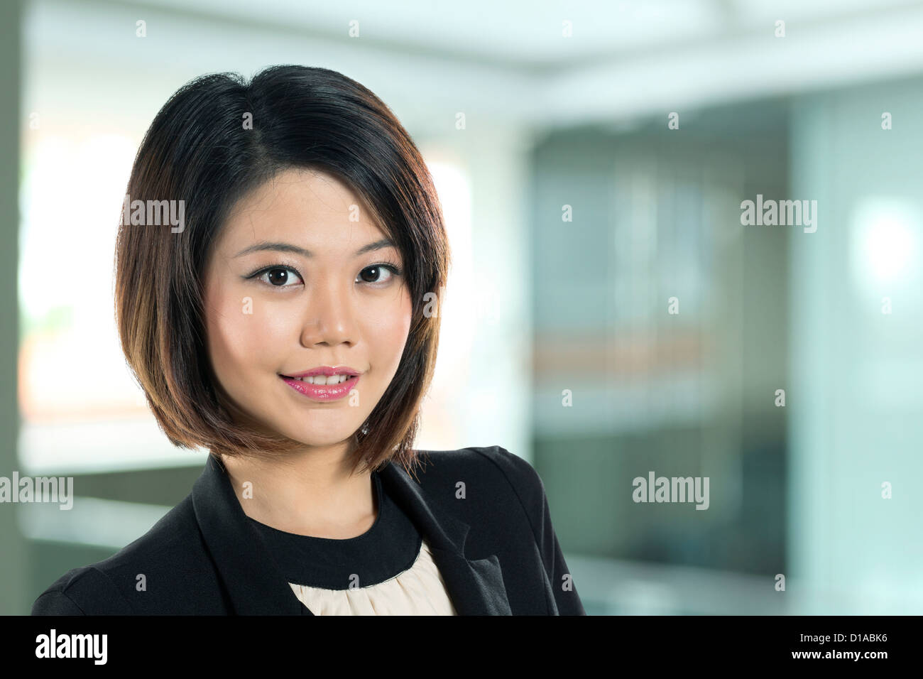 Beautiful Chinese business woman with friendly smile Stock Photo - Alamy