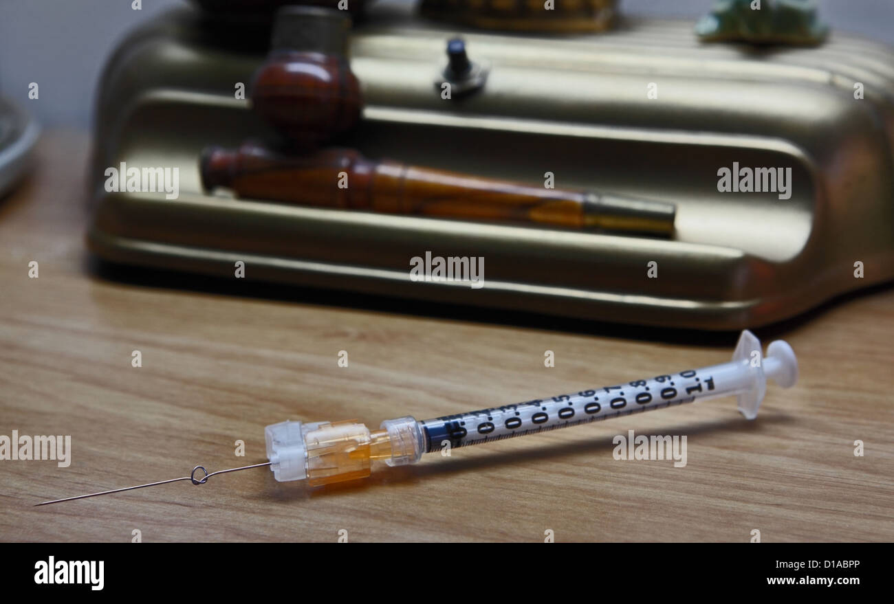 the needle of the syringe is knotted, preventing the discharge of its ...