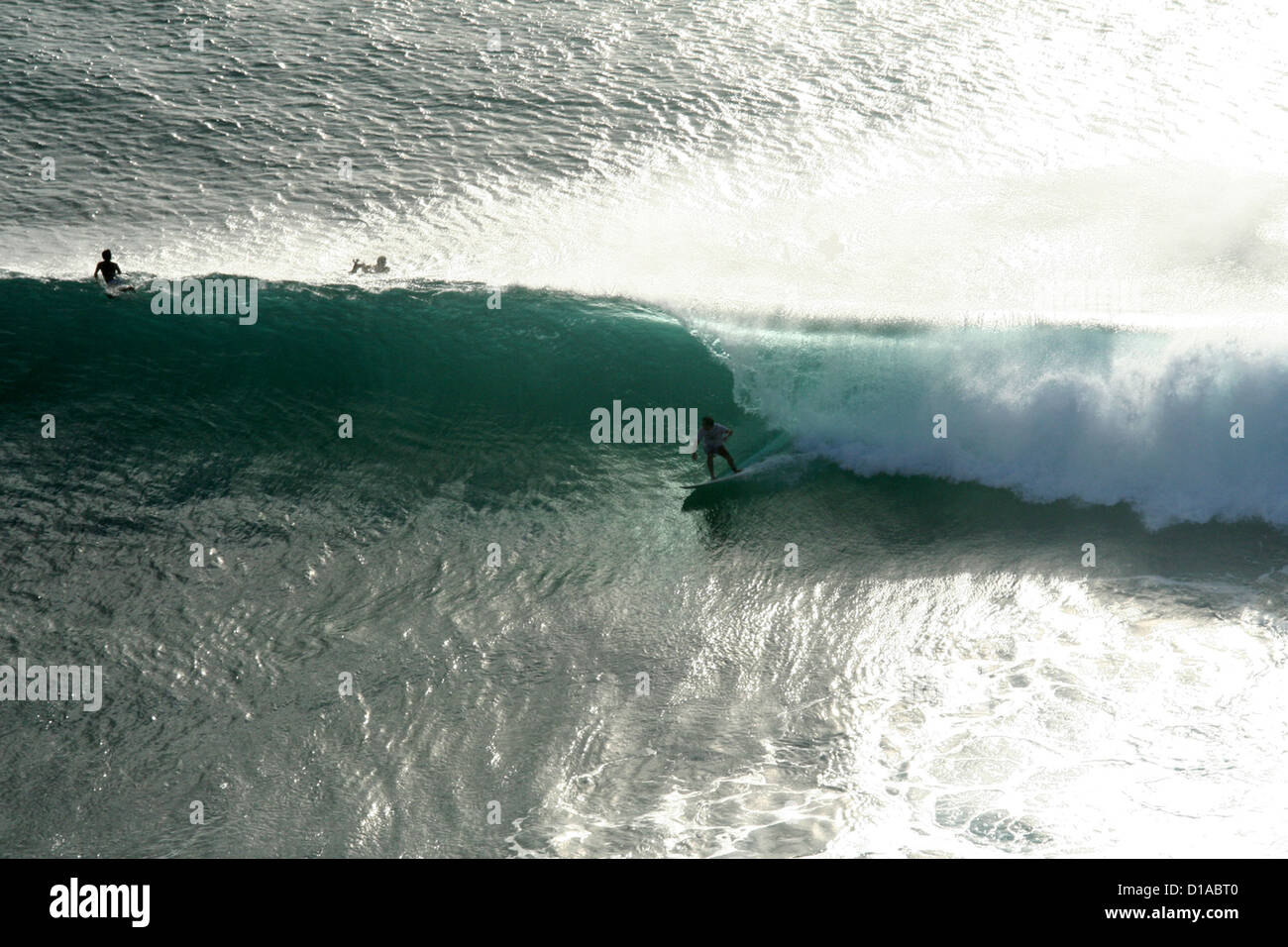 Surfers riding a tube wave, Maui, Hawaii Stock Photo - Alamy