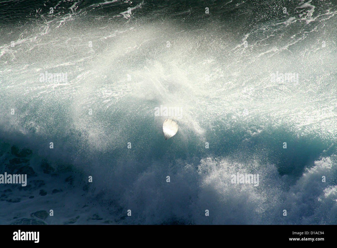 Giant wave spitting out surfboard after surfer wipe out, maui, hawaii ...