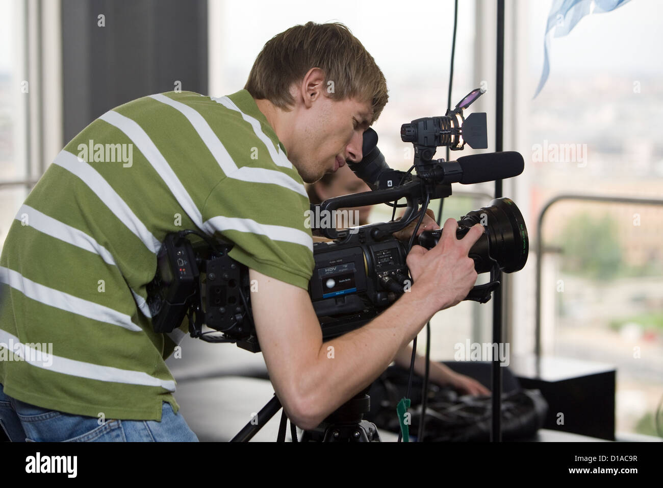 Berlin, Germany, TV cameraman filming Stock Photo - Alamy