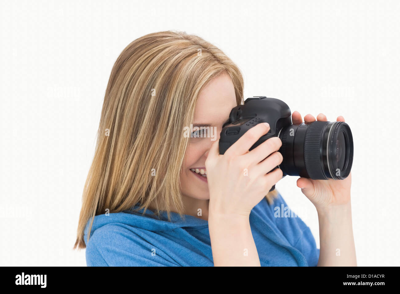 Side view of happy female photographer with photographic camera Stock ...
