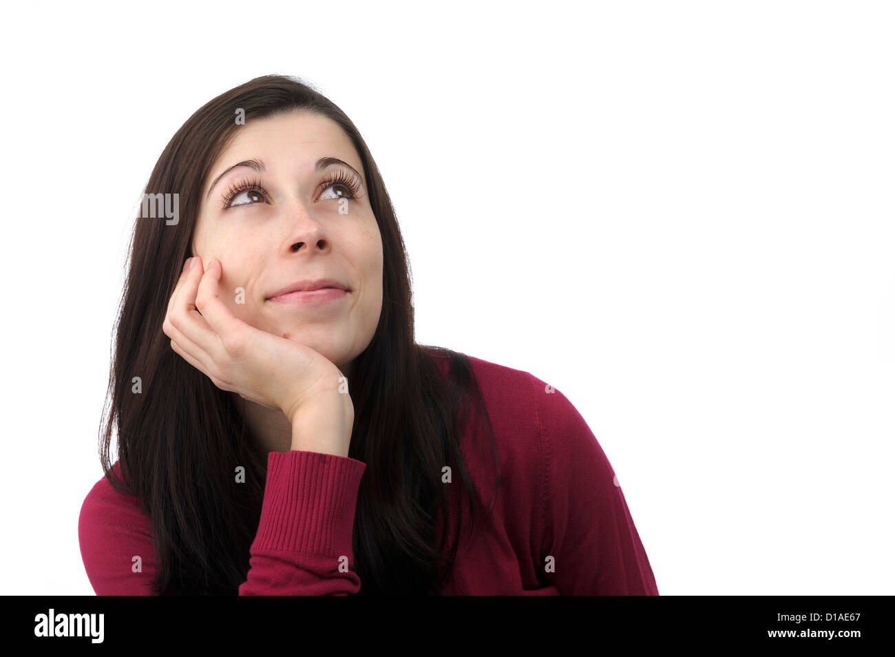 Portrait of young woman with a dreamy look on her face, isolated on ...