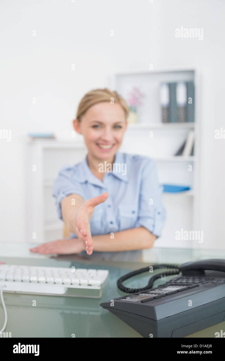 Business woman offering handshake at office Stock Photo - Alamy