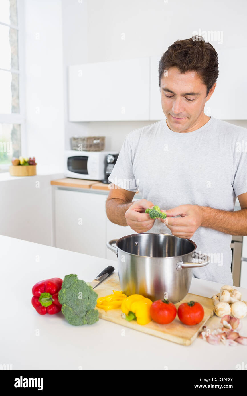 Man making vegetarian dinner Stock Photo - Alamy