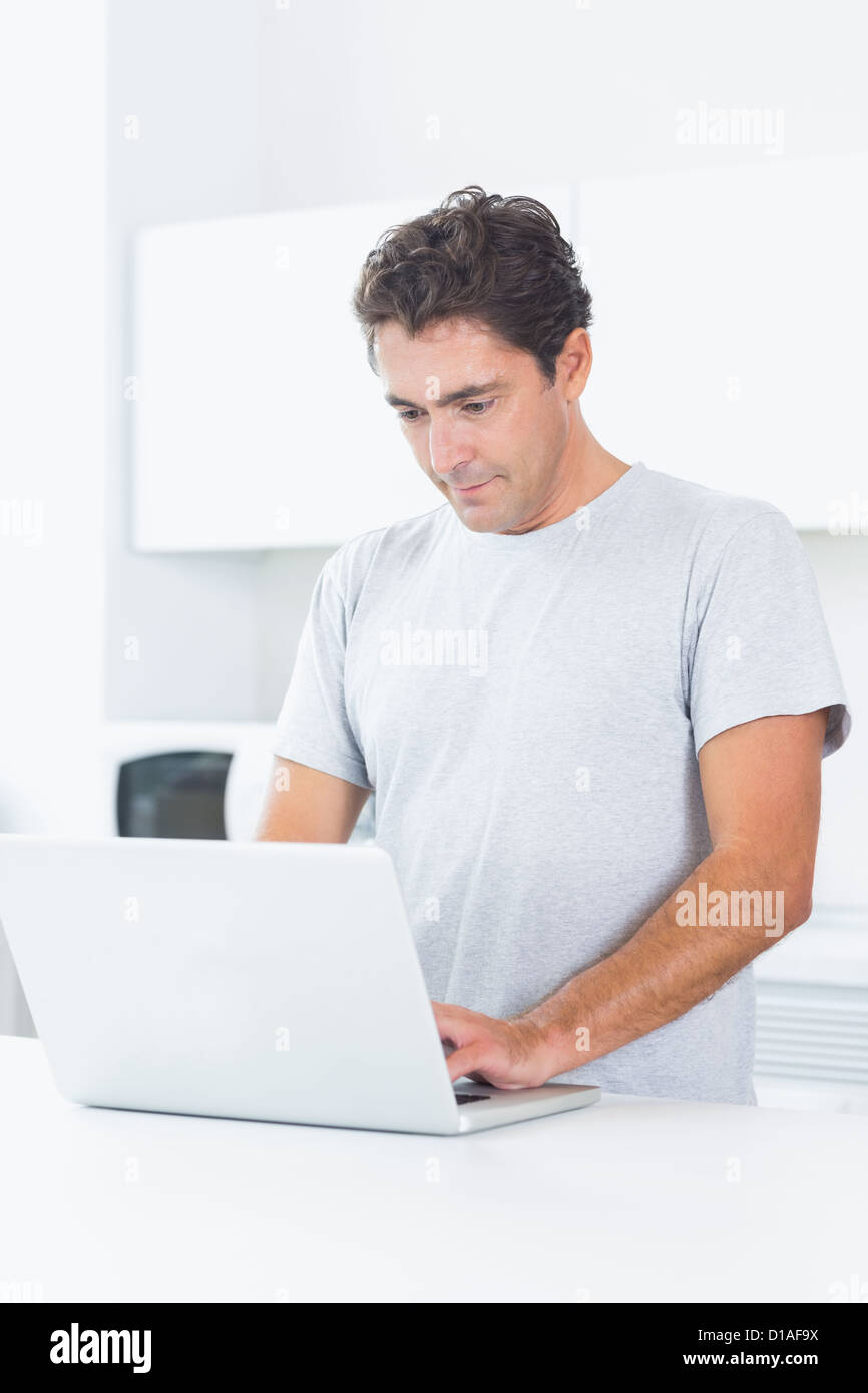Handsome man using laptop Stock Photo - Alamy