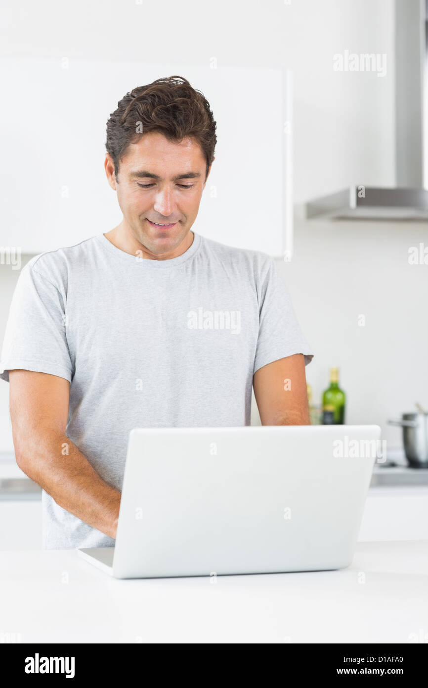 Happy man with laptop Stock Photo - Alamy