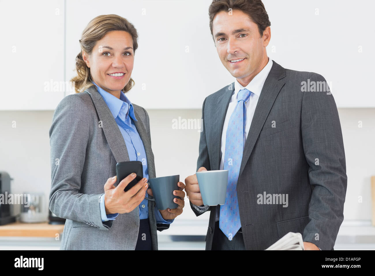 Power couple having coffee before work Stock Photo - Alamy