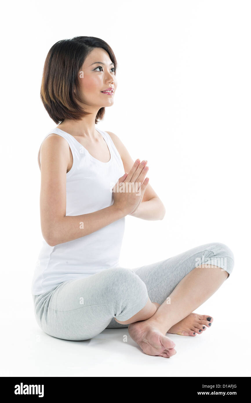 Portrait of a beautiful Chinese woman doing yoga exercise Stock Photo ...