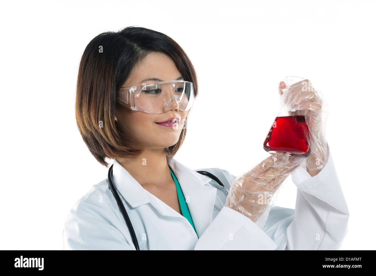 An Chinese scientific researcher holding at a liquid solution in a lab ...