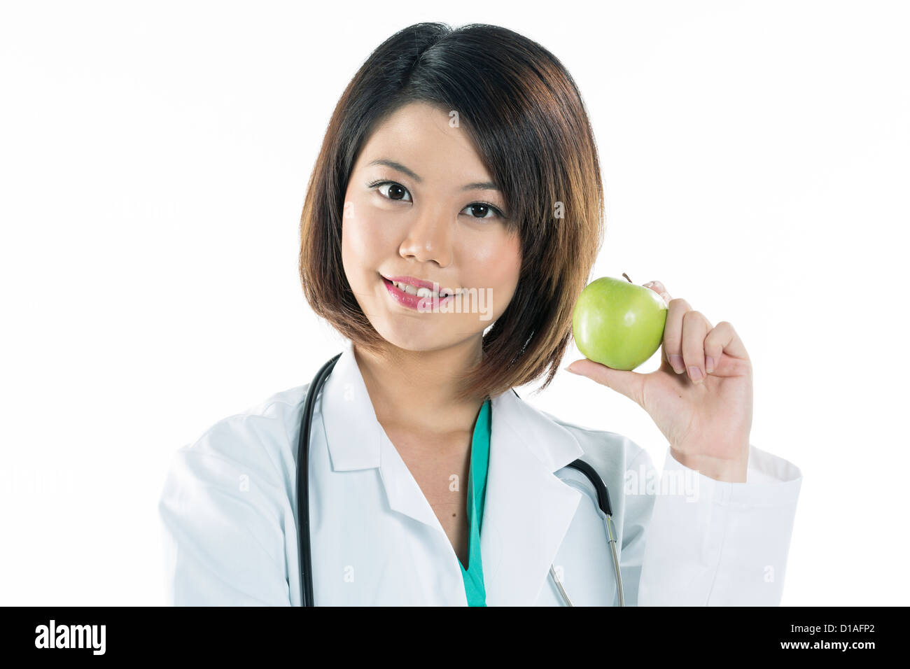 Close up portrait of a beautiful Chinese doctor holding an apple ...