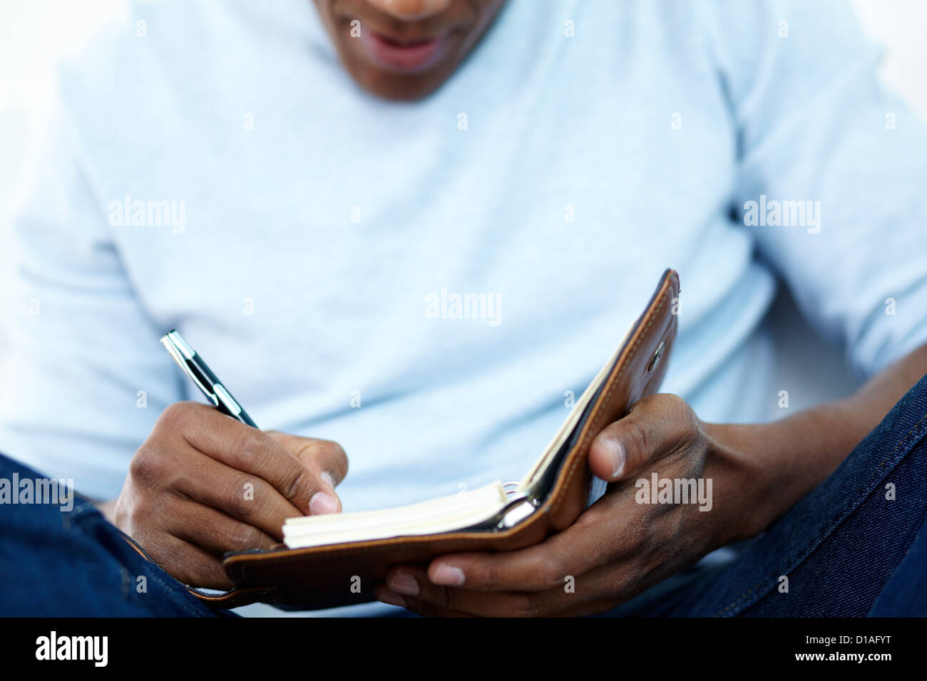 African hand writing in notepad hi-res stock photography and images - Alamy