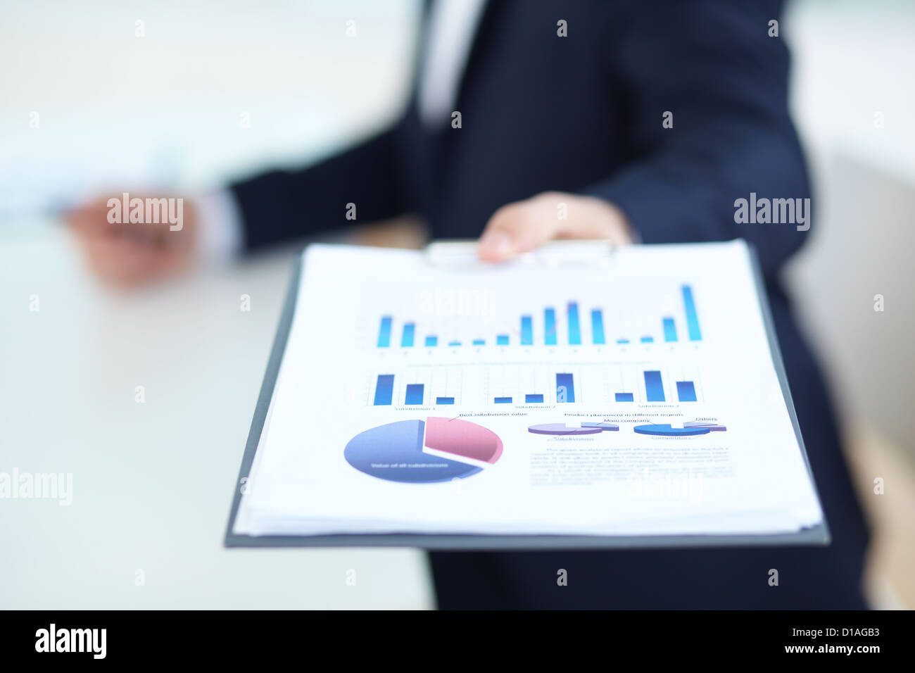 Close-up of business document being shown by businessman Stock Photo ...