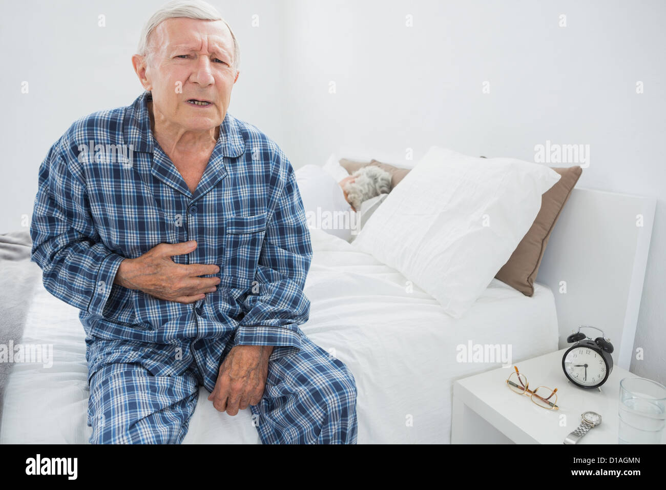 Old man suffering with body pain Stock Photo - Alamy