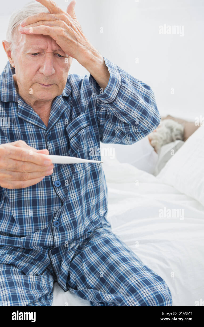 Old man taking his temperature Stock Photo - Alamy Old man taking his temperature Stock Photo - Alamy