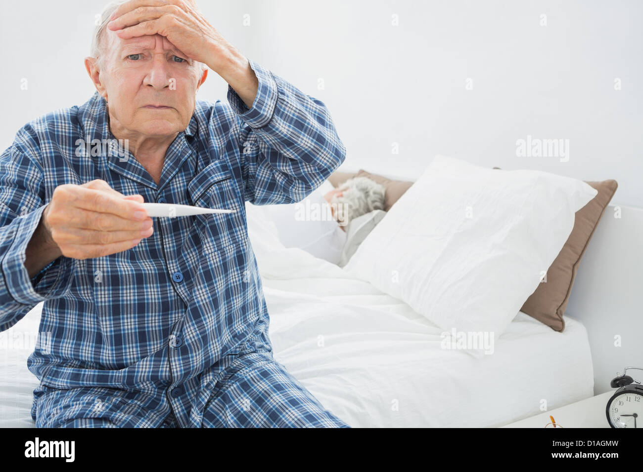 Old man with fever Stock Photo - Alamy