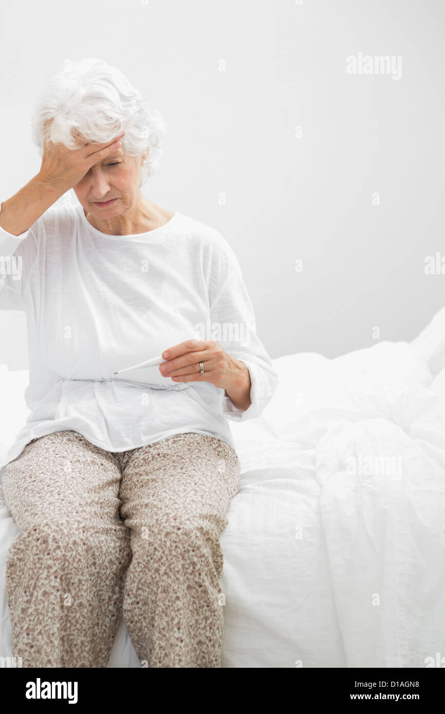 Old woman suffering with fever Stock Photo - Alamy