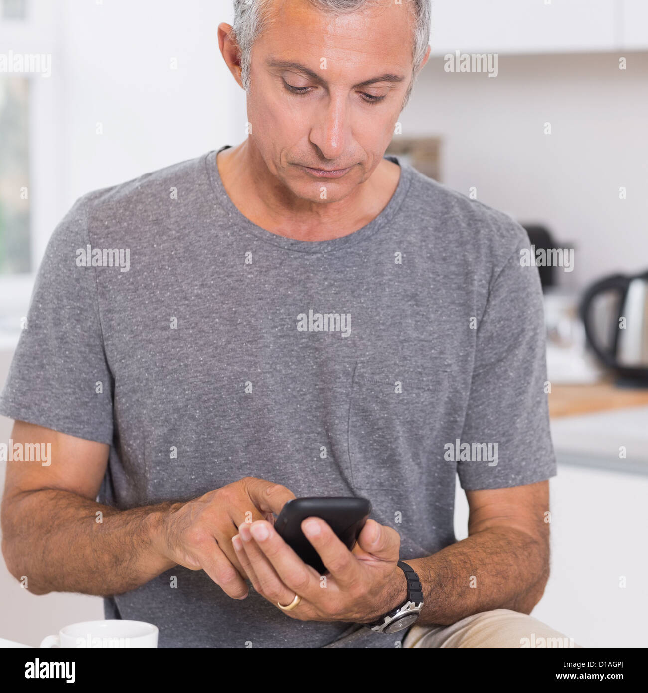 Man touching his smartphone Stock Photo - Alamy