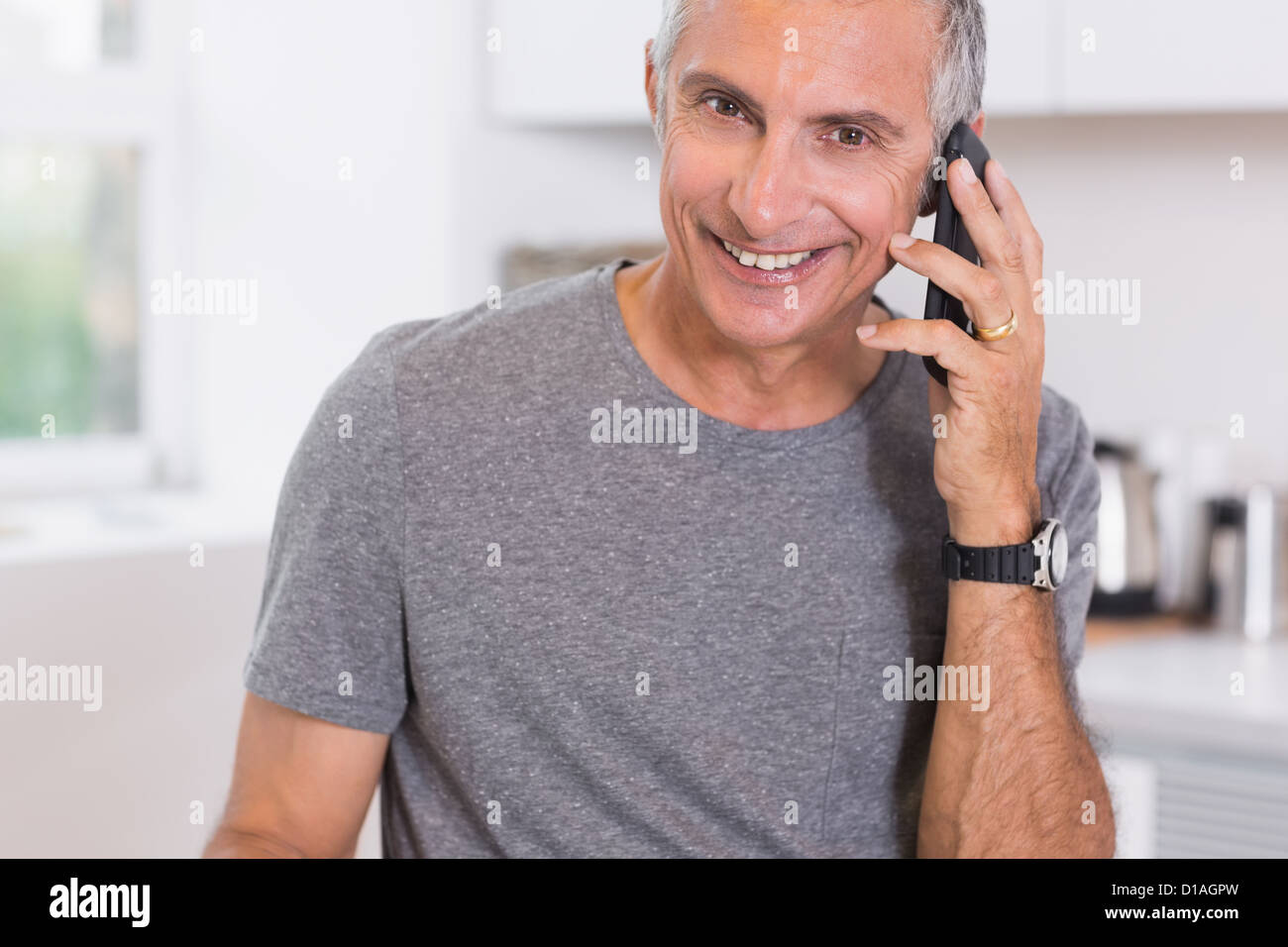 Smiling man on the phone Stock Photo - Alamy