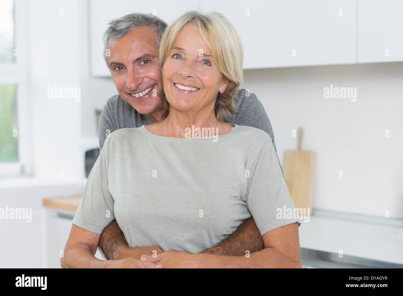 Happy mature couple hugging Stock Photo - Alamy