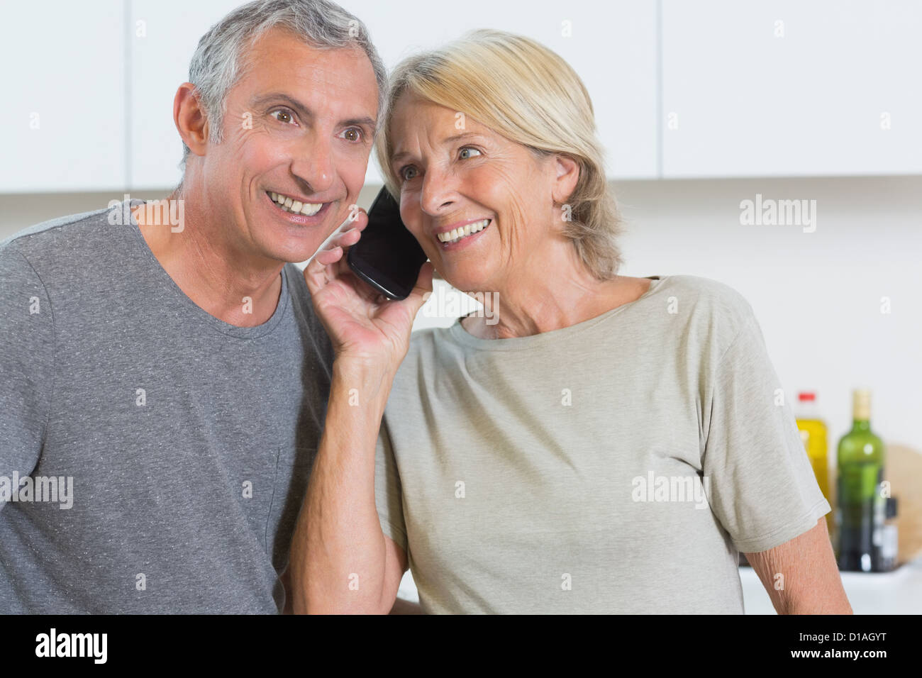 Couple taking a call together Stock Photo - Alamy